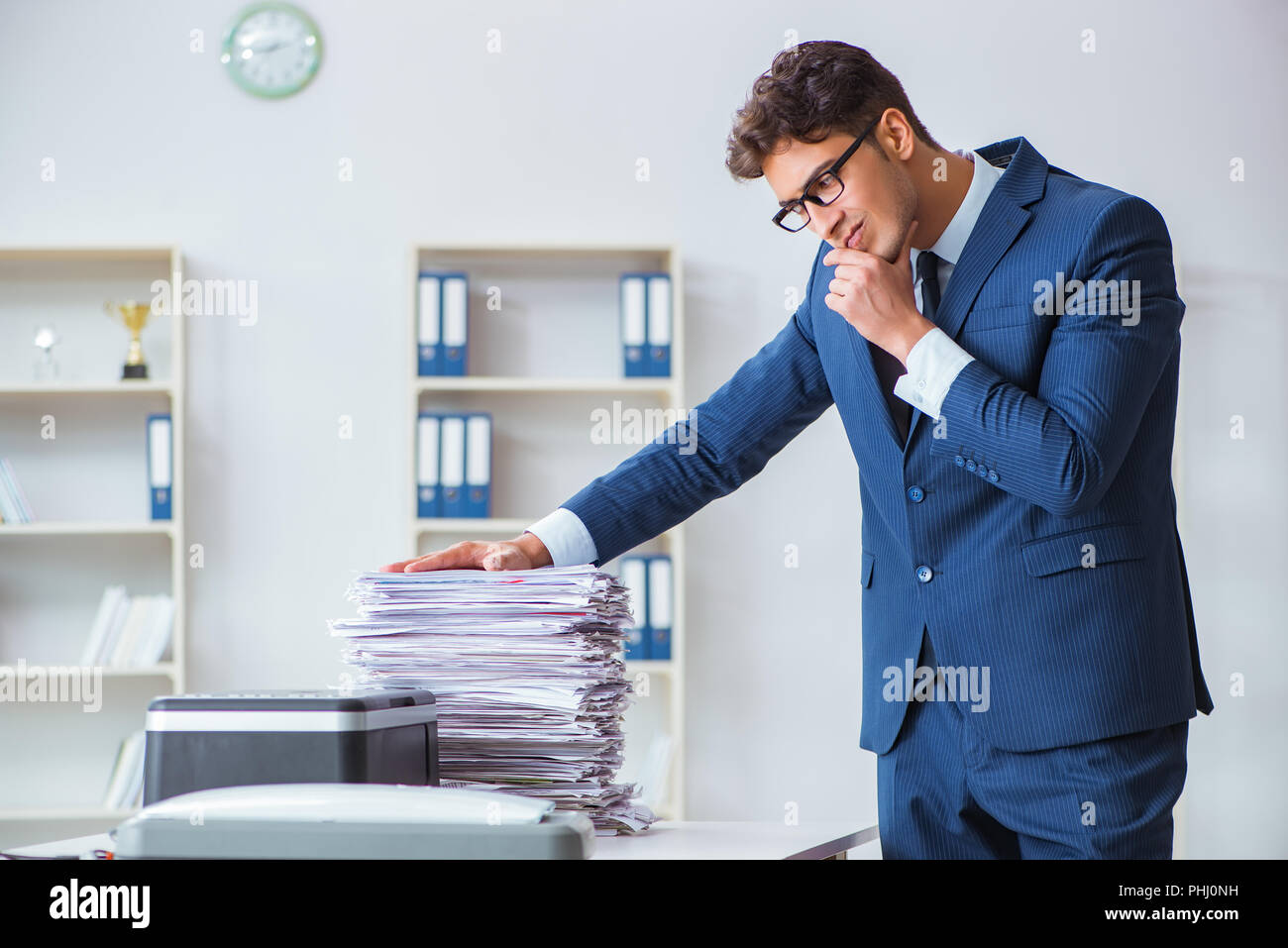 Businessman making copies in copying machine Stock Photo - Alamy