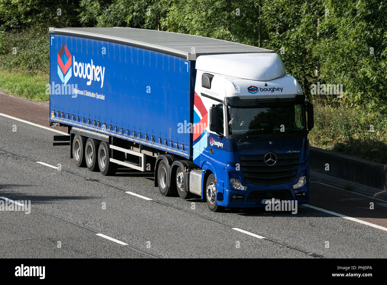 Heavy goods lorries logistics transport vehicles on the M6 at Lancaster ...