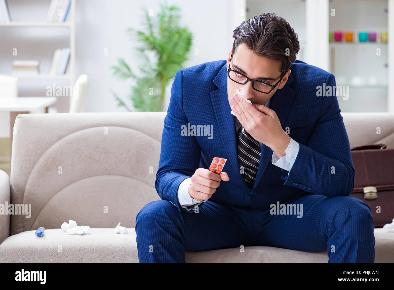 Sick employee staying at home suffering from flue Stock Photo - Alamy