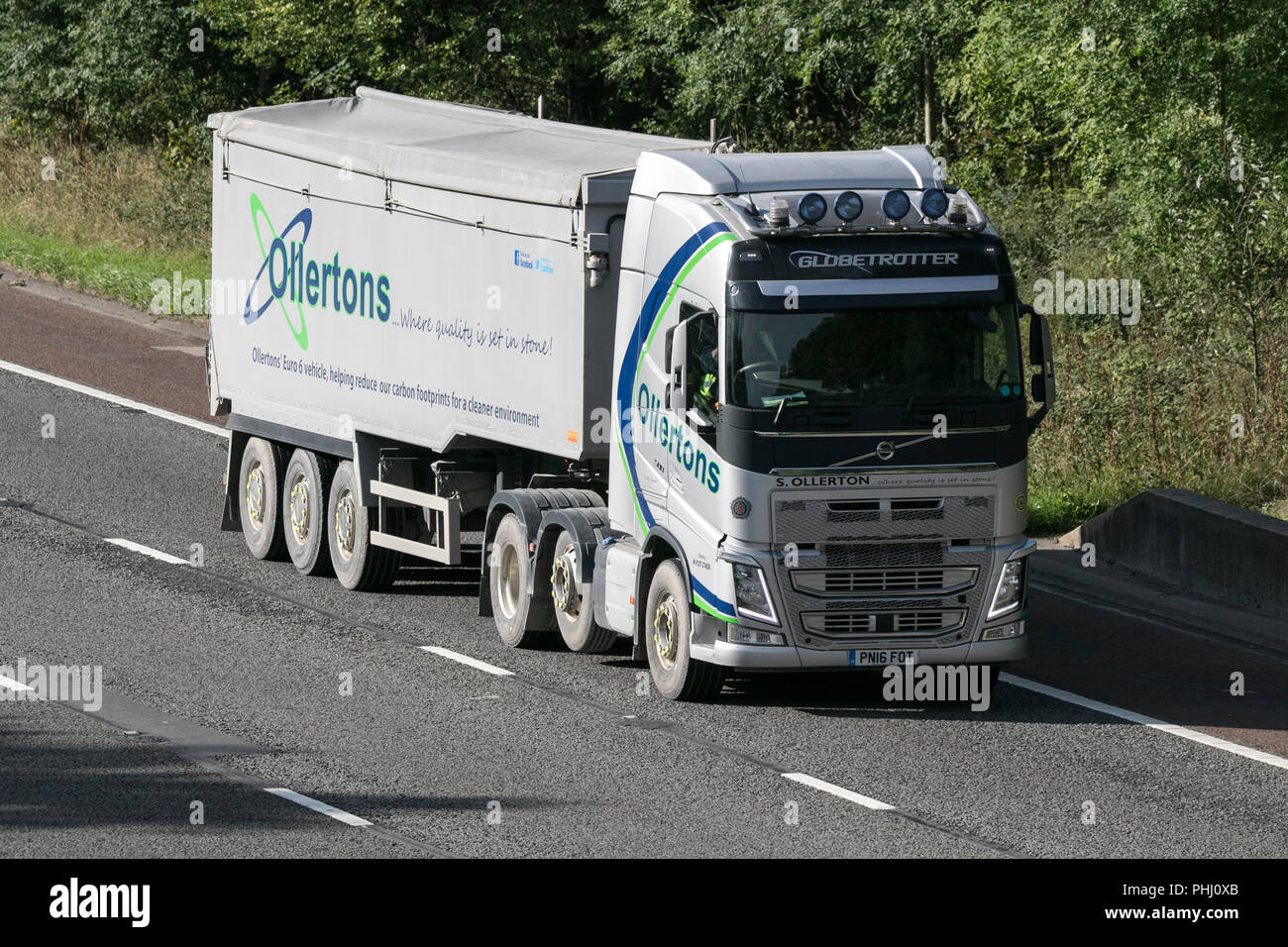 Heavy goods lorries logistics transport vehicles on the M6 at Lancaster ...