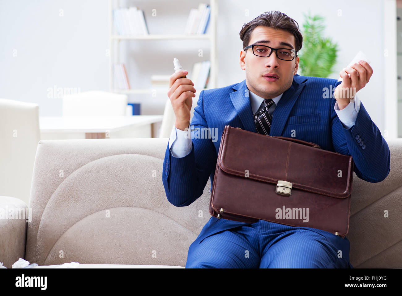 Sick employee staying at home suffering from flue Stock Photo - Alamy