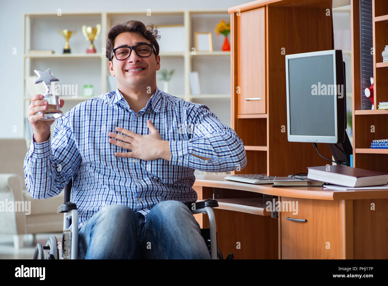 Disabled student studying at home on wheelchair Stock Photo - Alamy