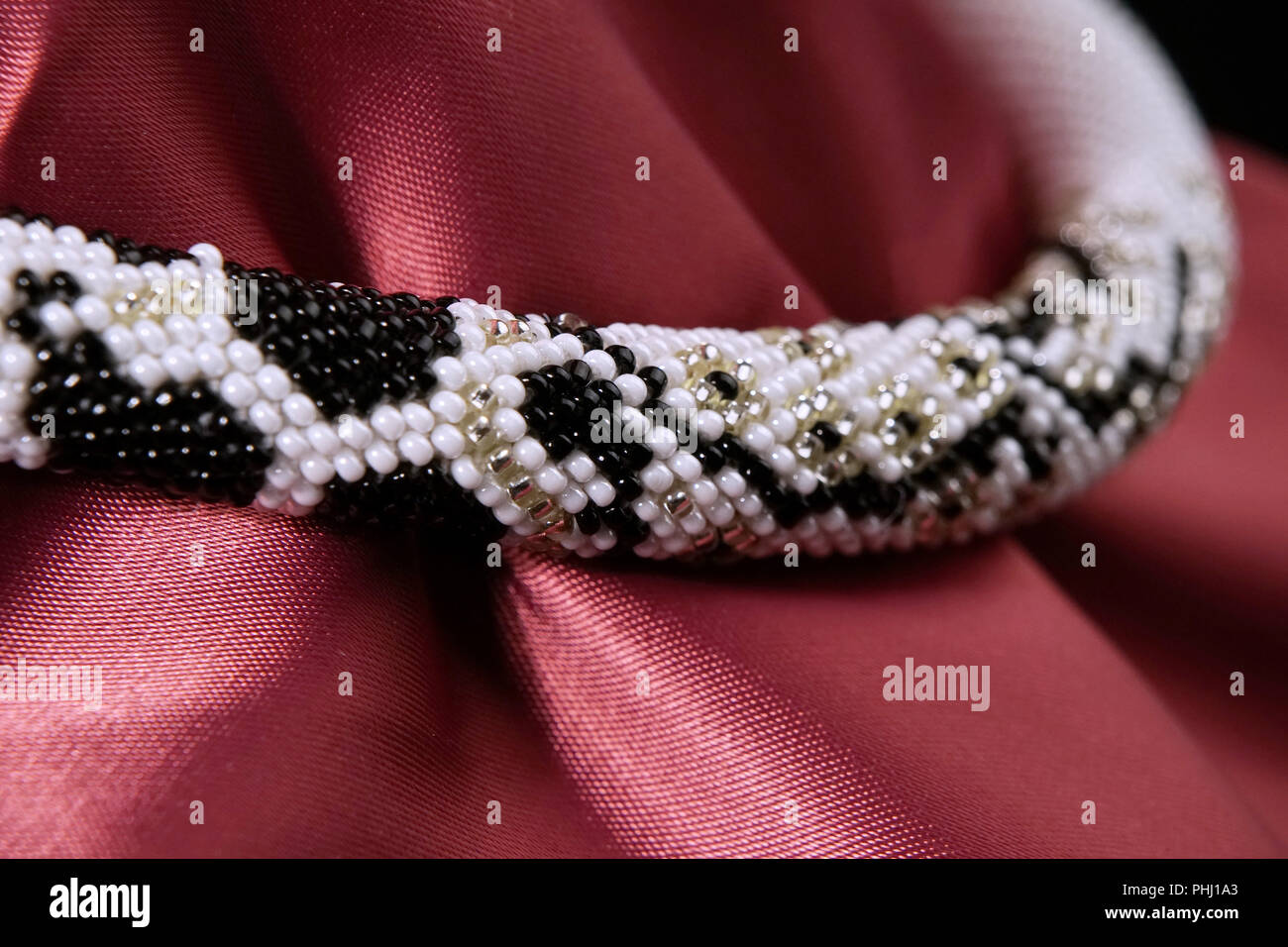 Bead rope, seed beads, bead necklace. Macro view on white and black ...