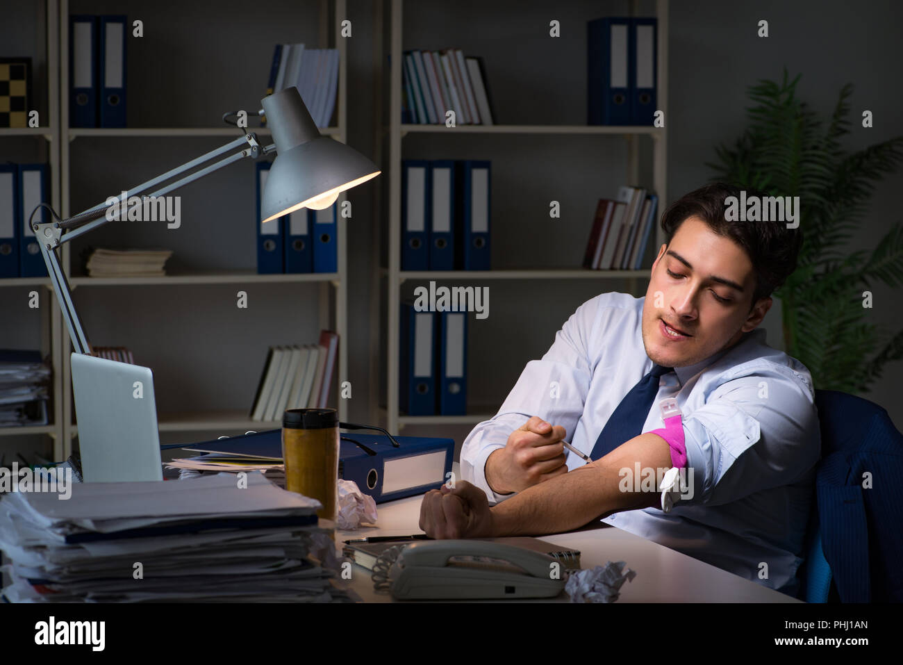 Employee relieving stress from overtime with drugs narcotics Stock ...