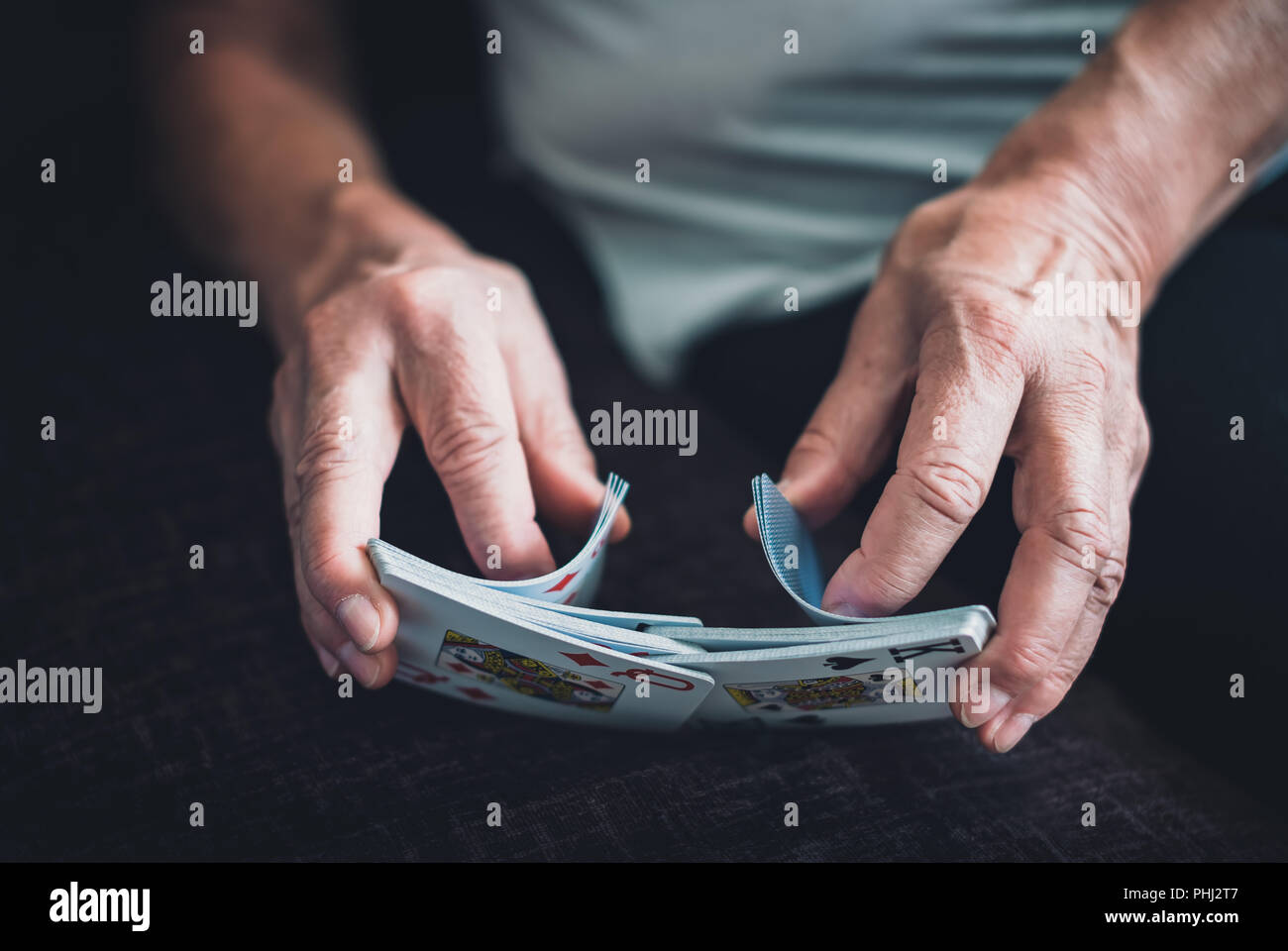 Woman shuffling cards Stock Photo - Alamy