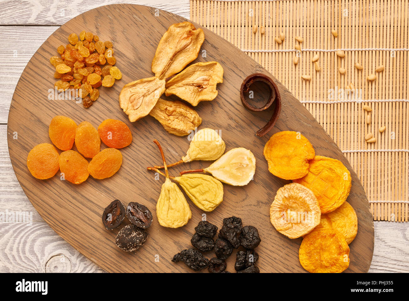 Dried fruits on wooden background Stock Photo - Alamy