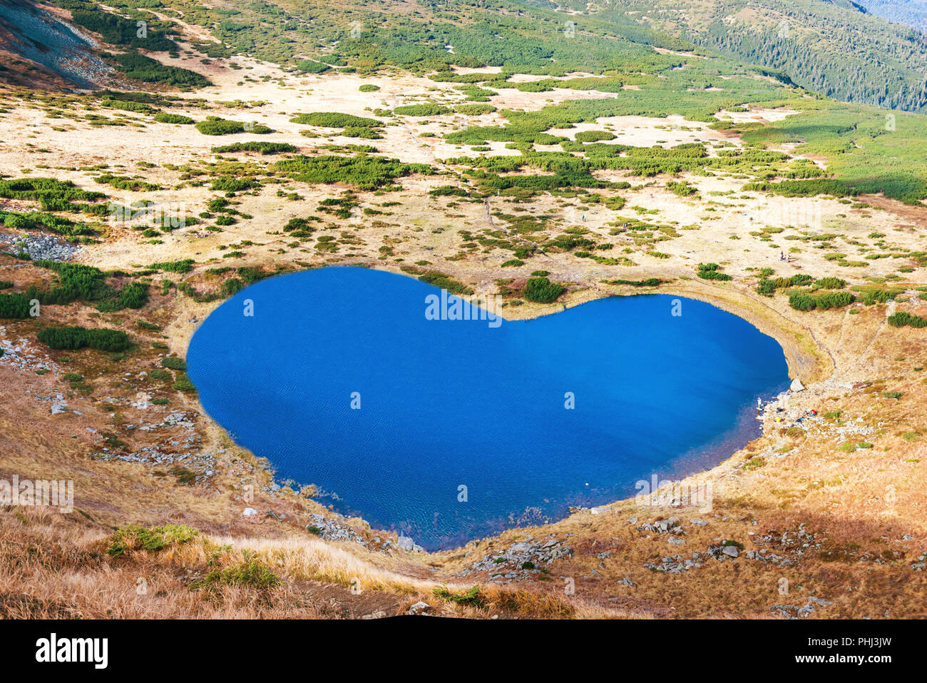 Aerial view of heart-shape mountains lake Stock Photo - Alamy