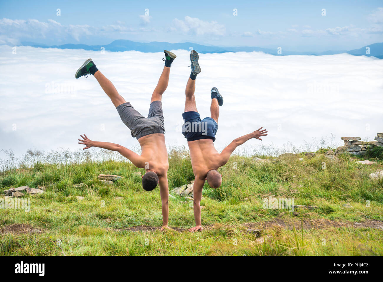 Two men dancing and making acrobatic tricks Stock Photo - Alamy
