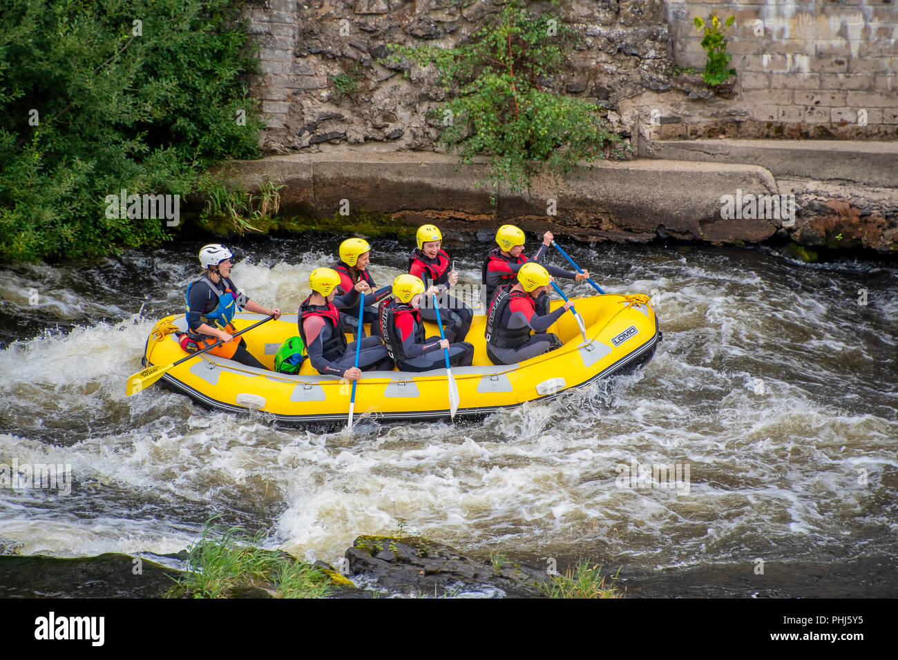 LLANGOLLEN WALES UNITED KINGDOM - AUGUST 27 2018: White water rafting ...
