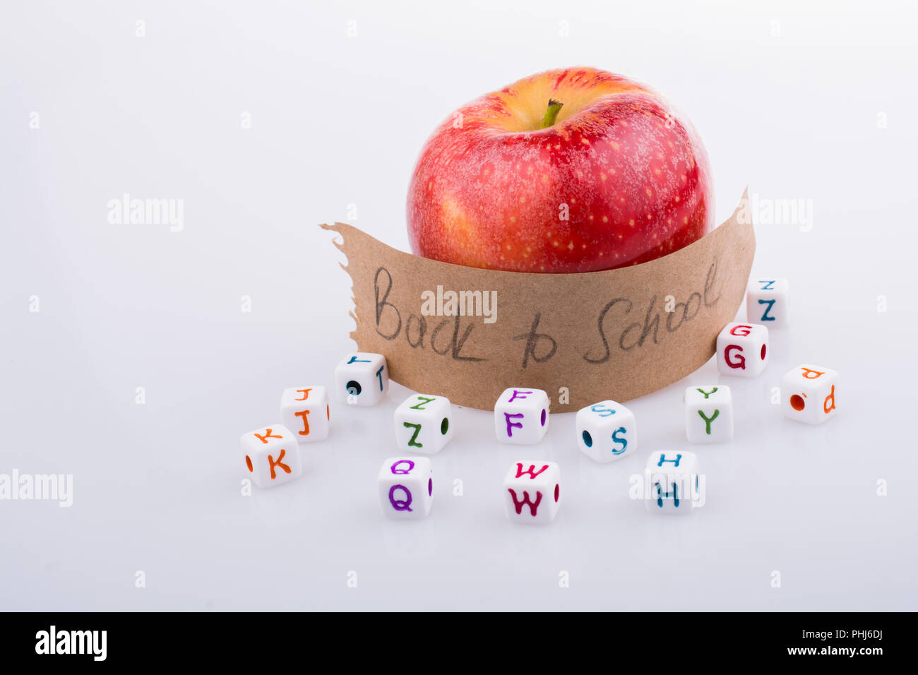 Back to school theme with a red apple Stock Photo - Alamy