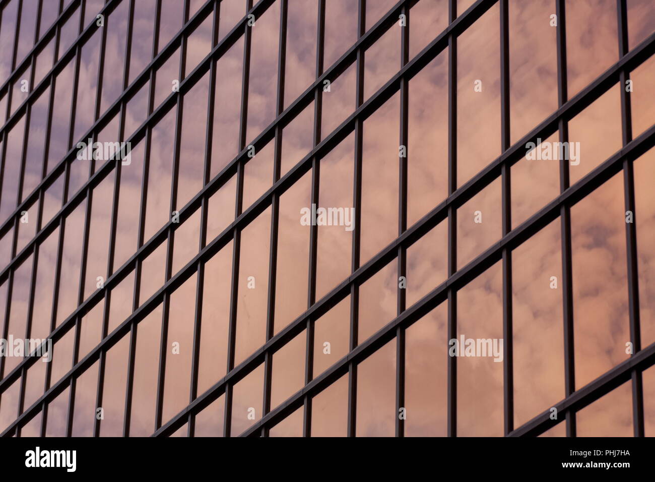 Exterior windows of a commercial office building Stock Photo - Alamy