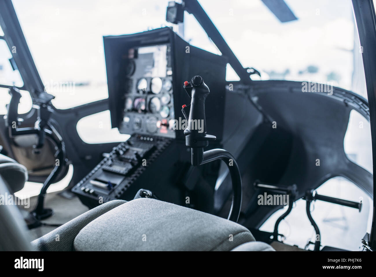Inside helicopter cabin, control panel, side view from opened door ...