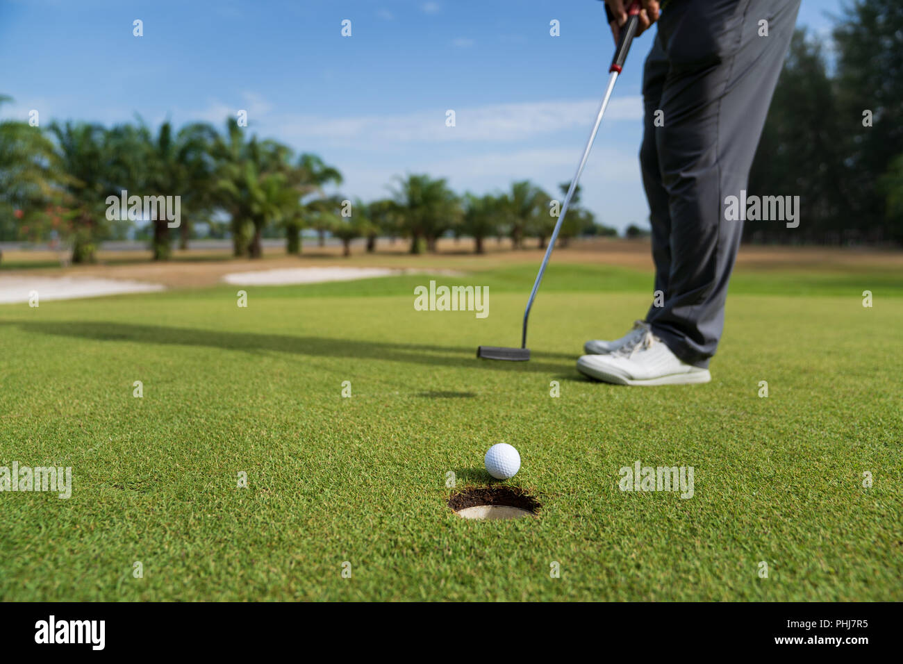 Golf player putting off ball hi-res stock photography and images - Alamy
