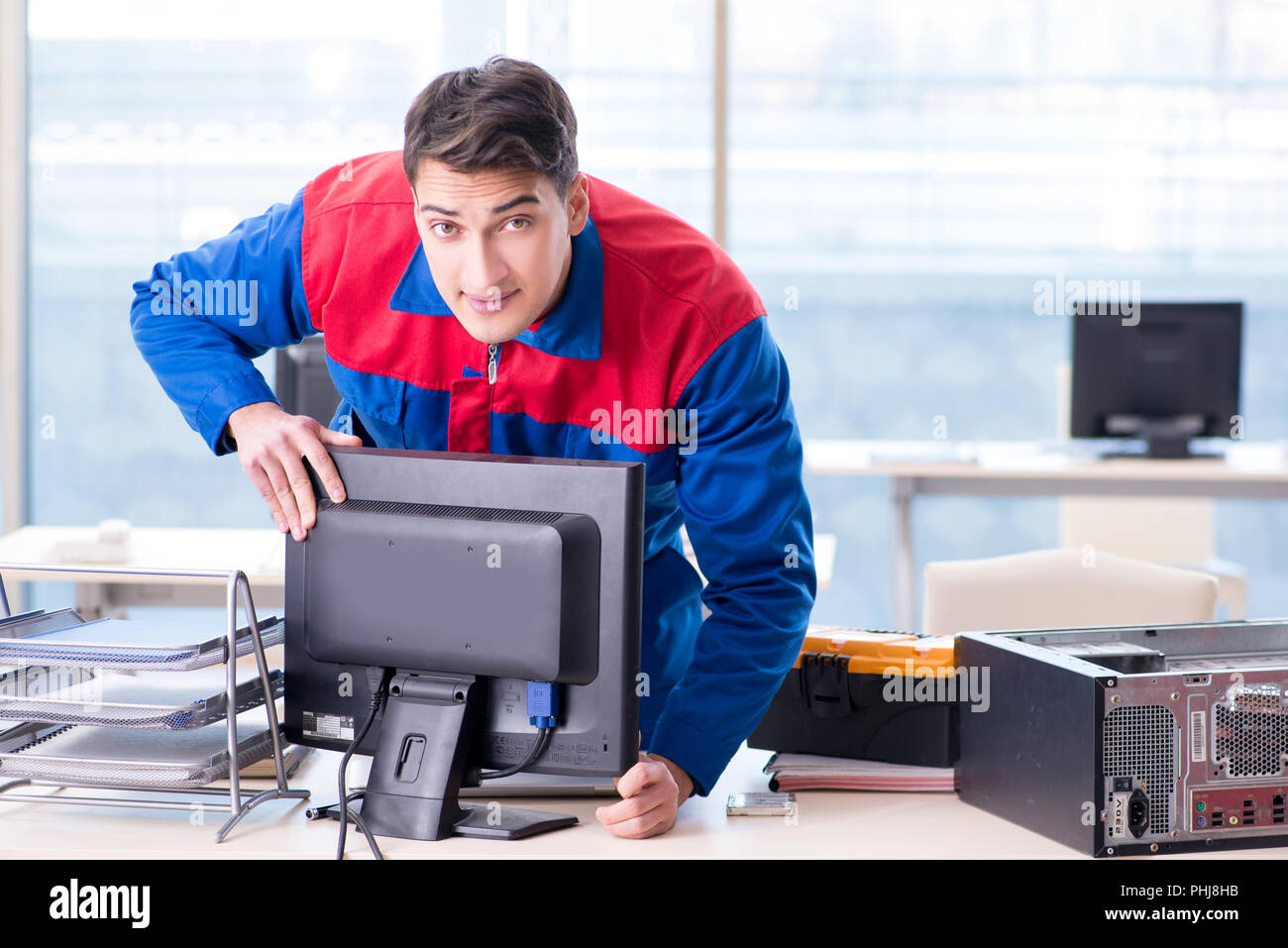 Computer repairman specialist repairing computer desktop Stock Photo ...