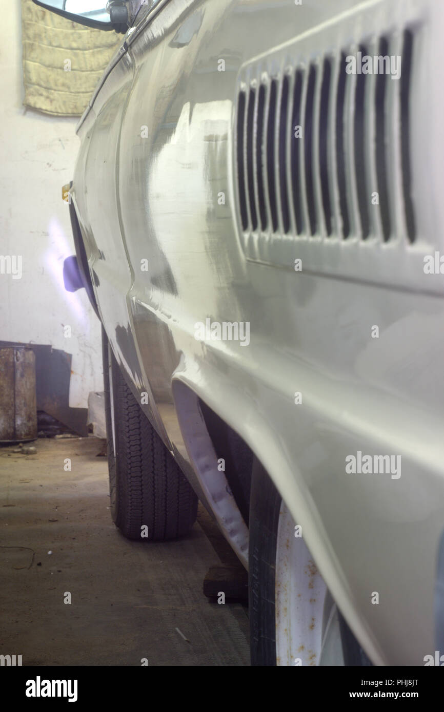 open air intake of old car in garage. side grille of outlet air intake ...