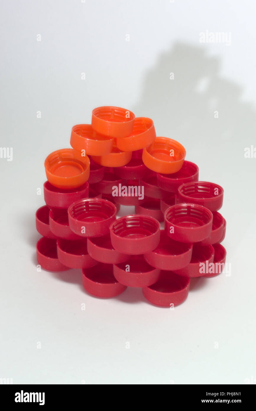 annular small wall made of multicolored plastic bottle caps cast ...