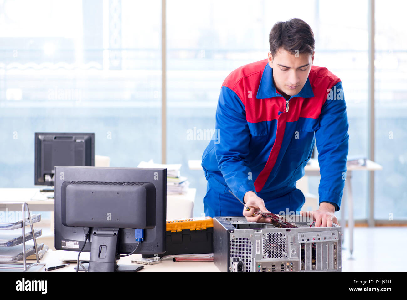 Computer repairman specialist repairing computer desktop Stock Photo ...