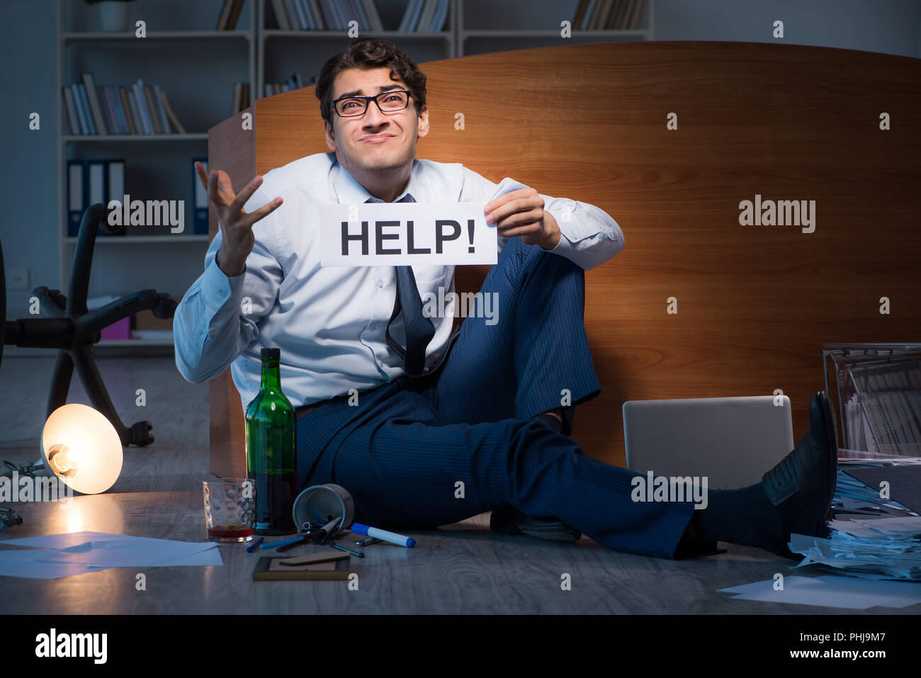 Employee asking for help and drinking under stress and despair Stock ...