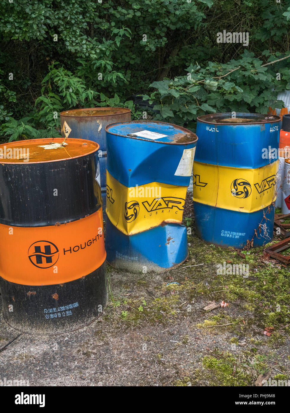 Empty industrial lubricant steel barrels awaiting disposal Stock Photo ...