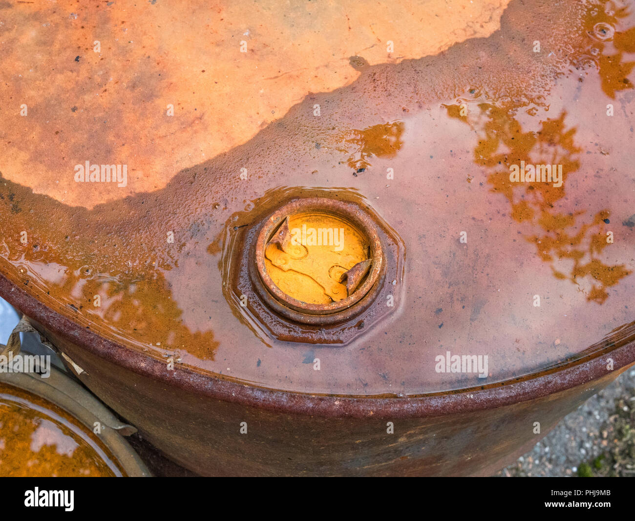 Empty industrial lubricant steel barrels awaiting disposal. Metal ...
