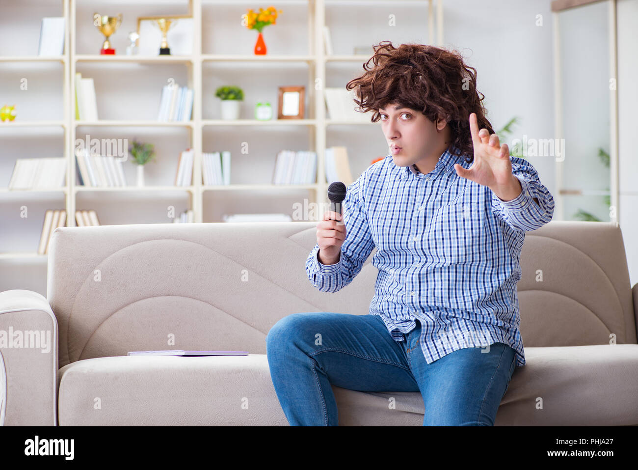 Funny man singing songs in karaoke at home Stock Photo - Alamy