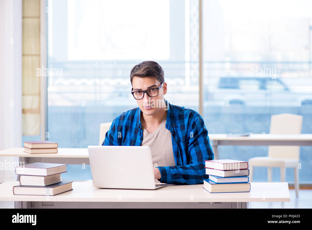 Student in telelearning distance learning concept reading in lib Stock ...