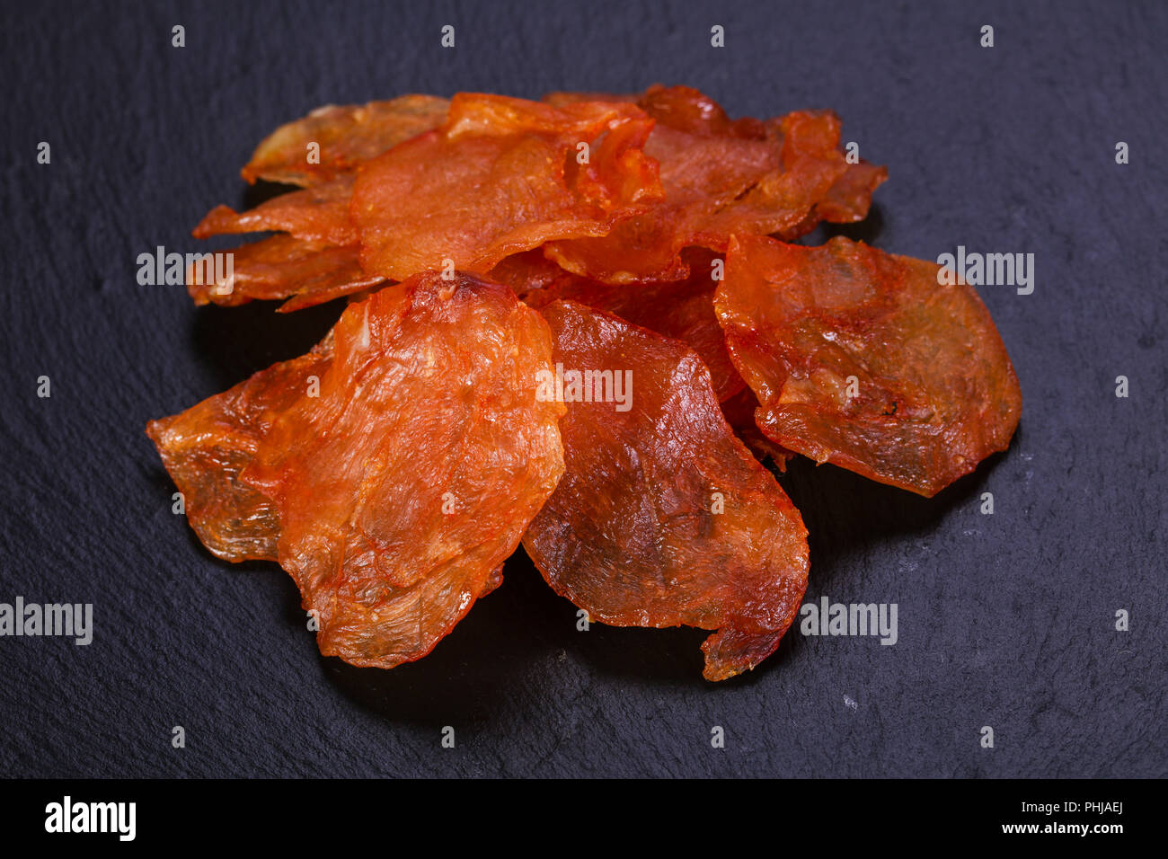 Dry chicken meat over wooden Stock Photo - Alamy