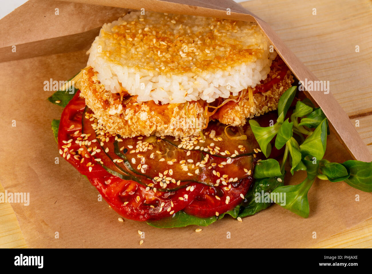Rice burger with crispy chicken Stock Photo - Alamy