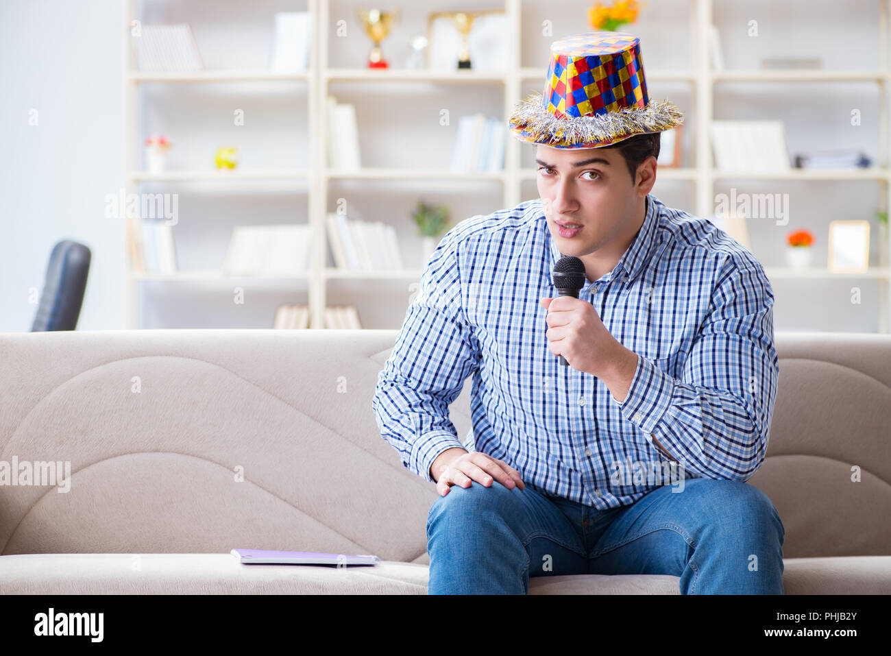 Funny man singing songs in karaoke at home Stock Photo - Alamy