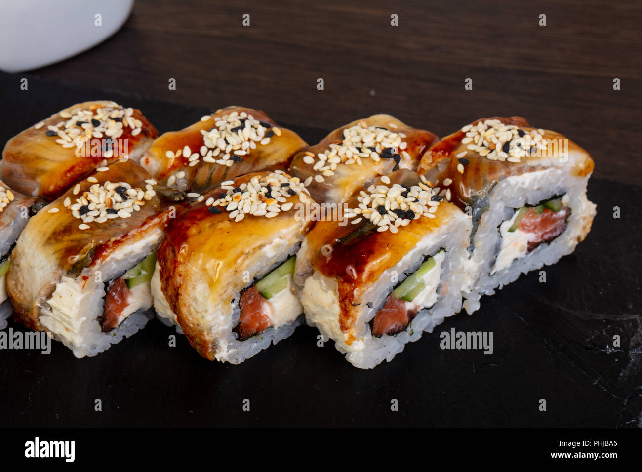Tasty eel sushi with sesame and teriyaki Stock Photo - Alamy