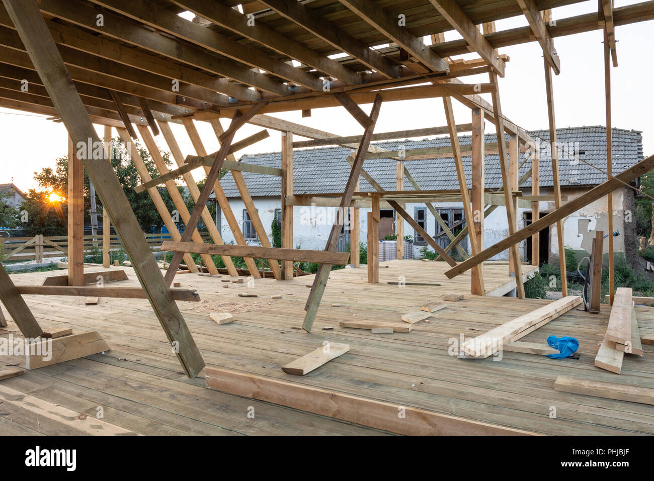 New construction home framing against blue sky at sunser, closeup of ...