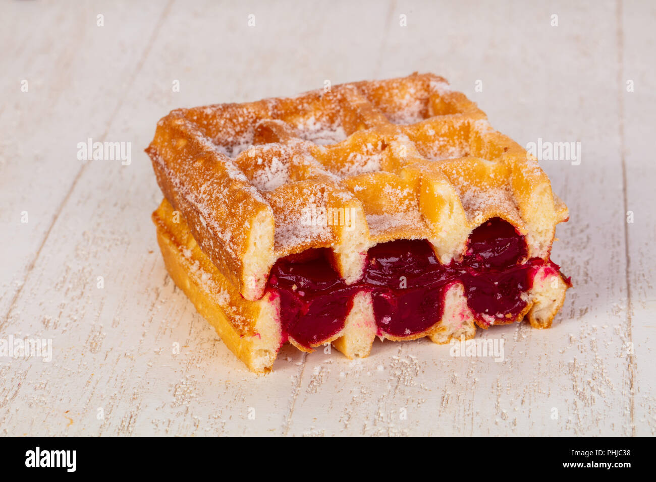 Sweet Waffle with berry jam Stock Photo - Alamy
