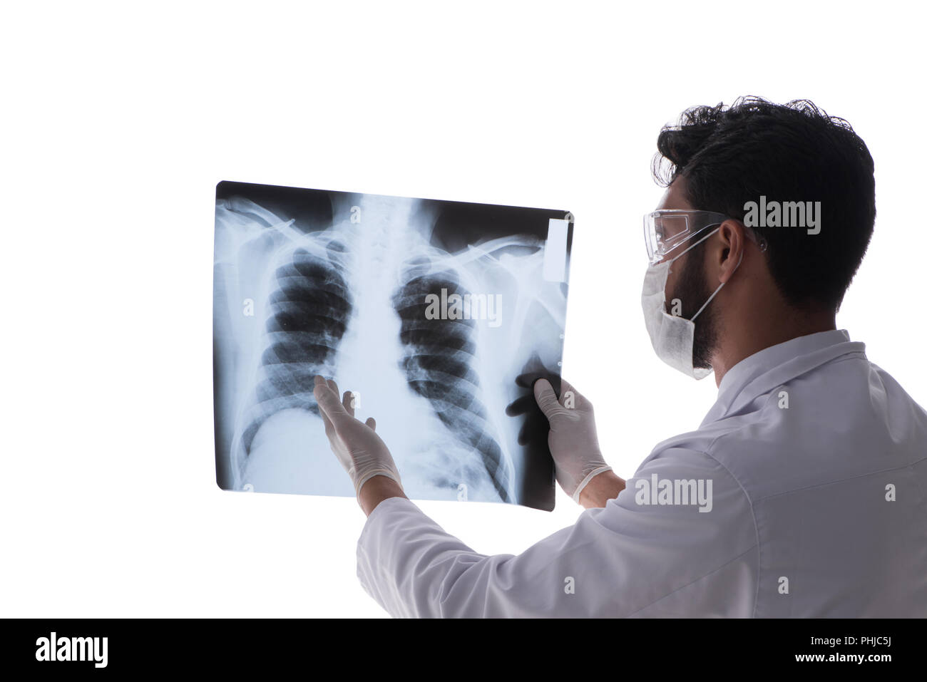 Young doctor looking at x-ray images isolated on white Stock Photo - Alamy