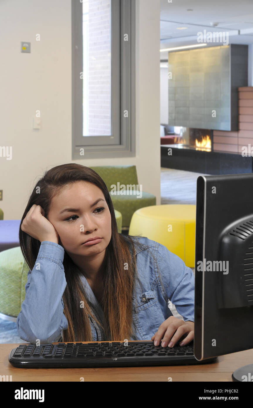 Woman on desktop computer Stock Photo - Alamy