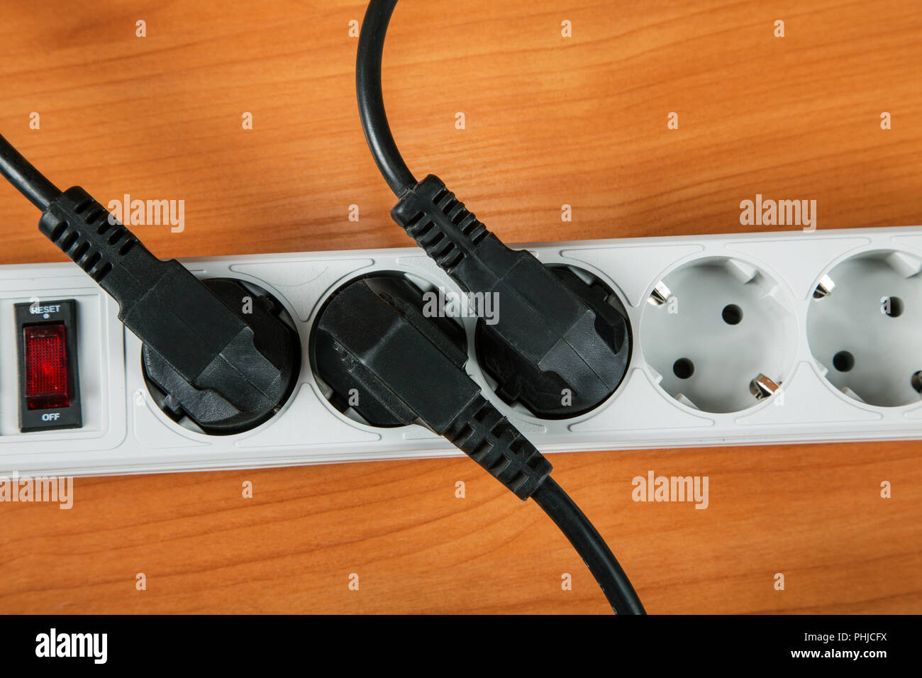 The electric extension piece with wires on table close up Stock Photo ...