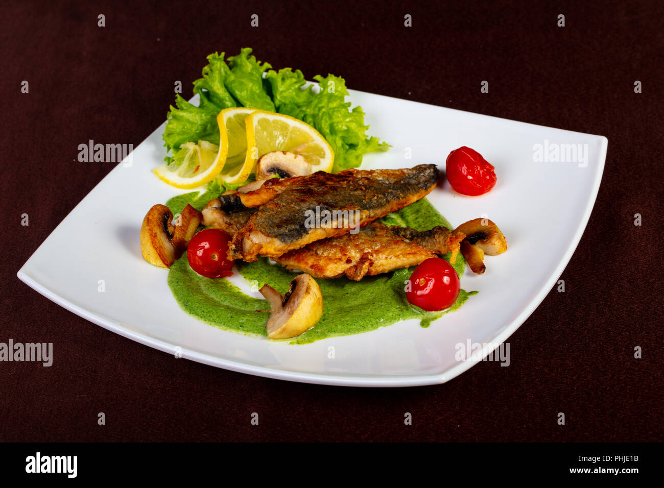 Roasted Dorado fish fillet with sauce Stock Photo - Alamy