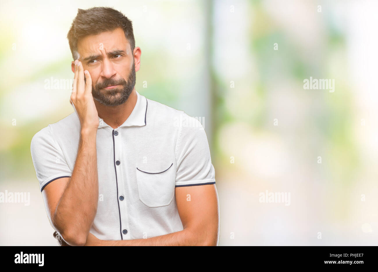 Adult hispanic man over isolated background thinking looking tired and ...