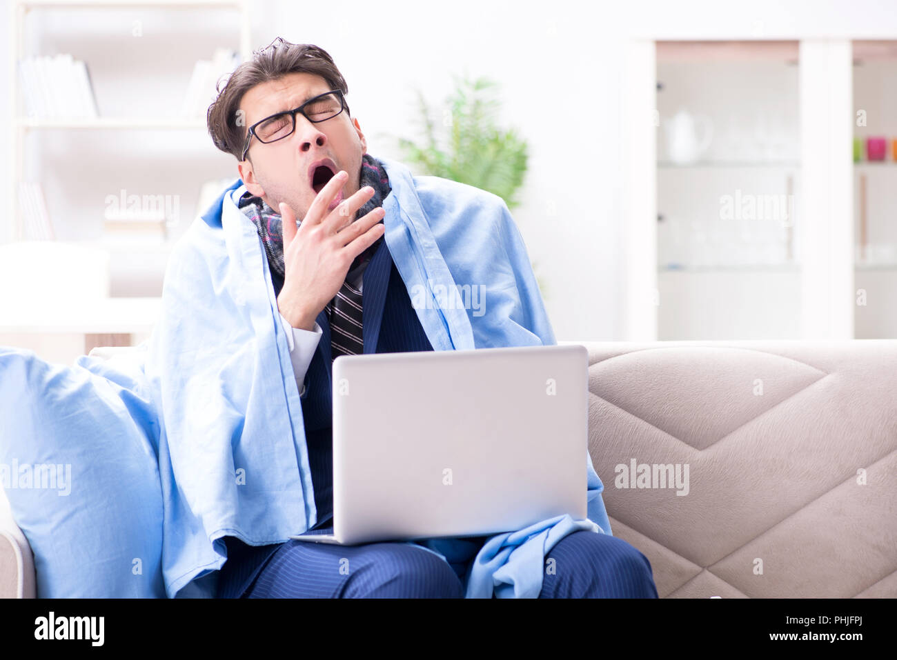 Sick businessman laptop computer temperature hi-res stock photography ...