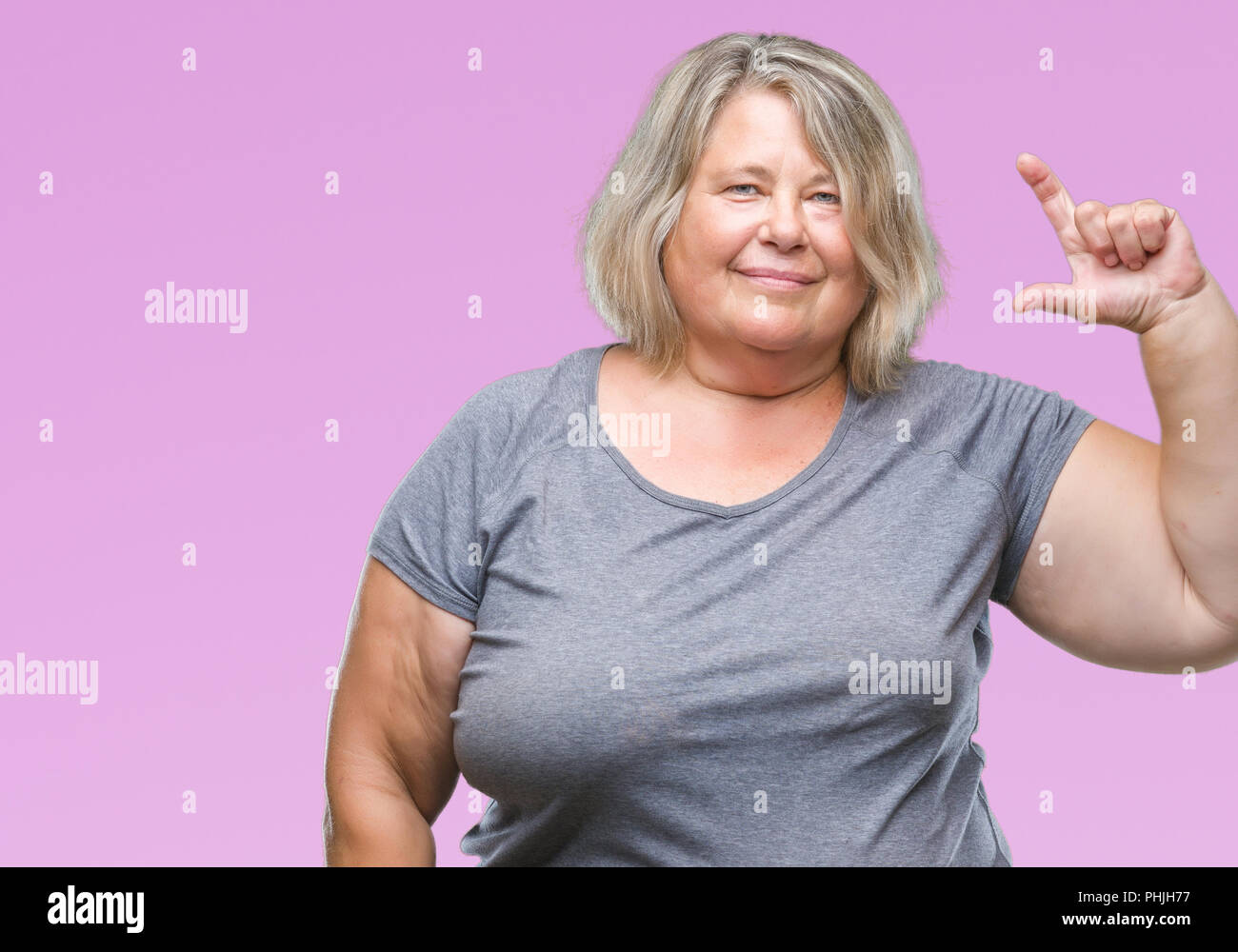 Senior plus size caucasian woman over isolated background smiling and ...