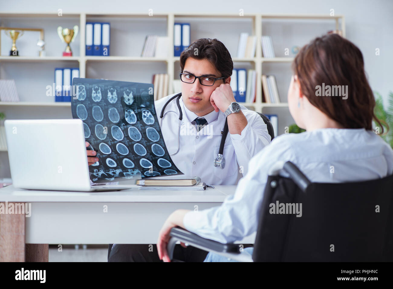 Doctor feeling pessimistic about x-ray image of patient Stock Photo - Alamy