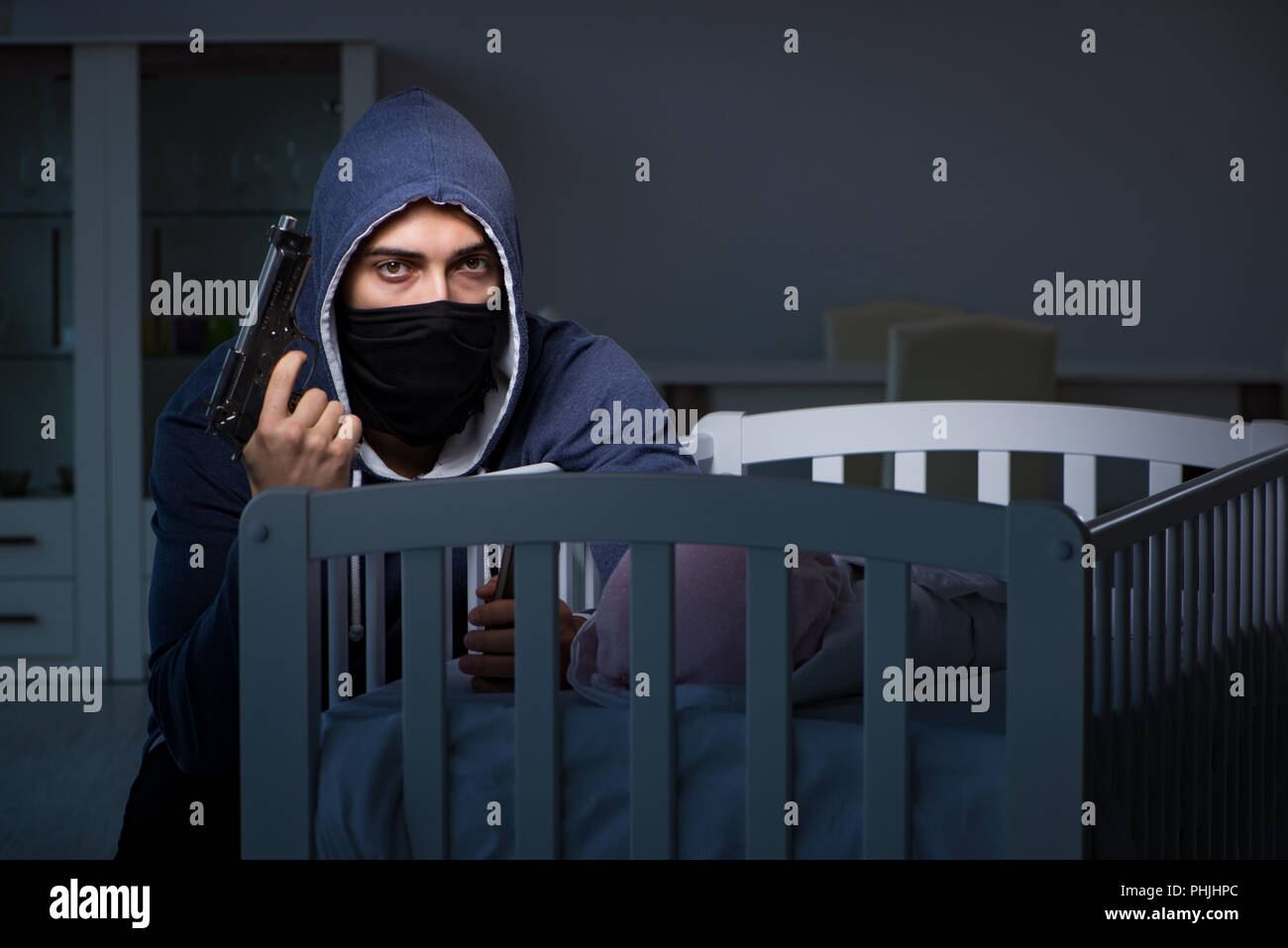 Criminal stealing baby in human child traficking concept Stock Photo ...