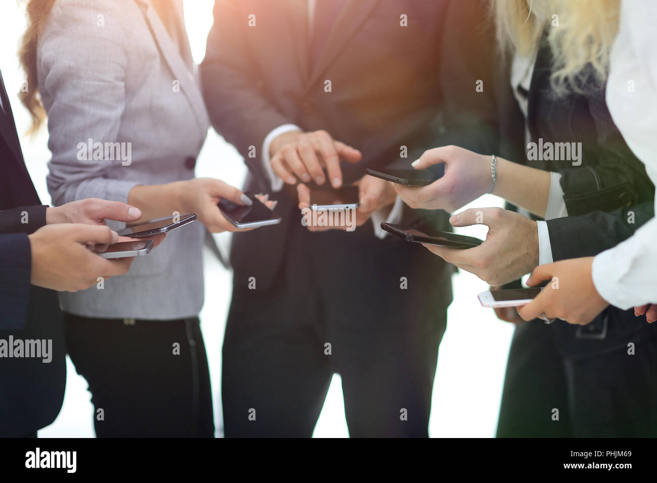 closeup.business team using smartphones Stock Photo - Alamy