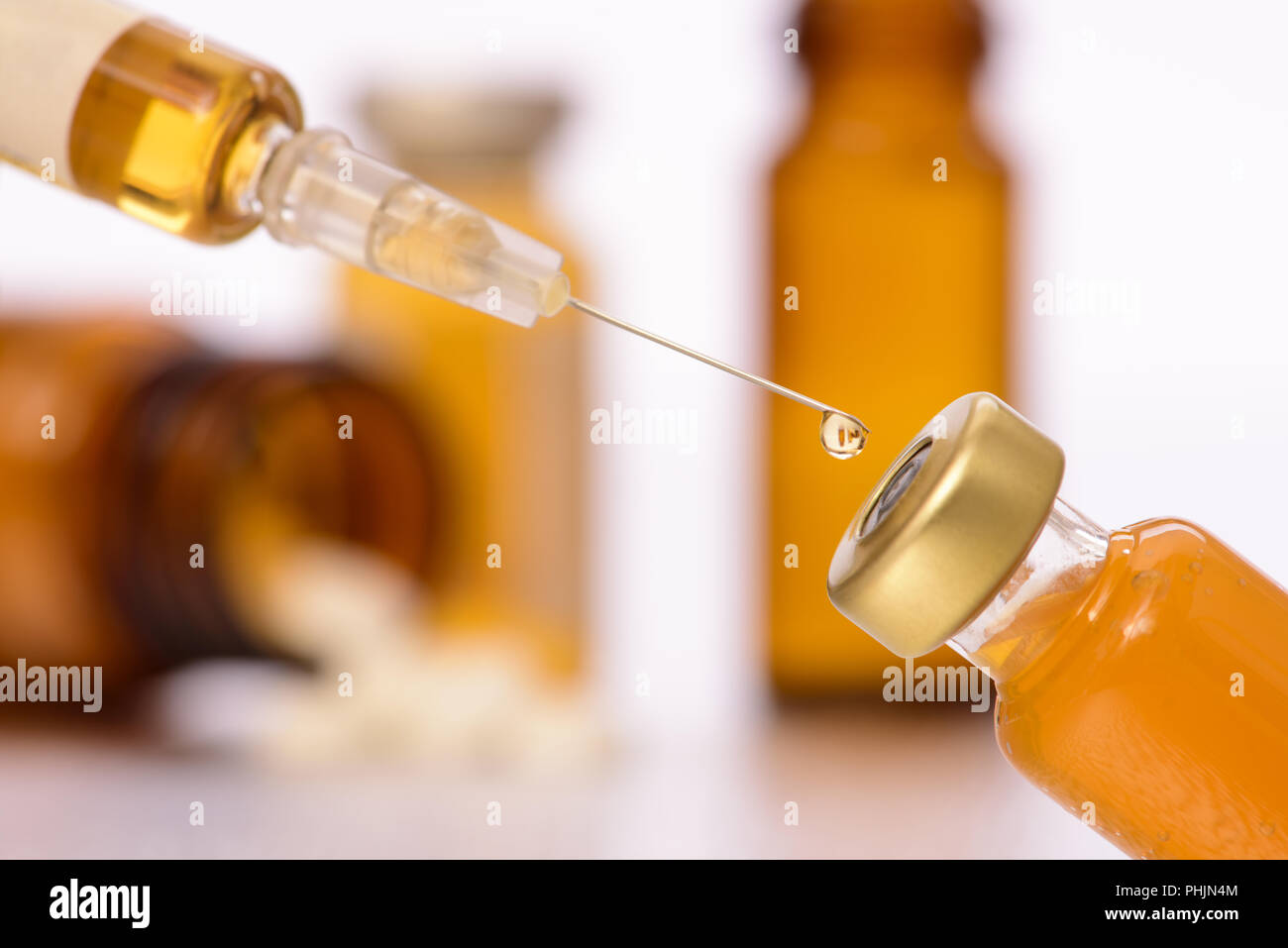 medical injection and vaccination with syringe and serum Stock Photo ...