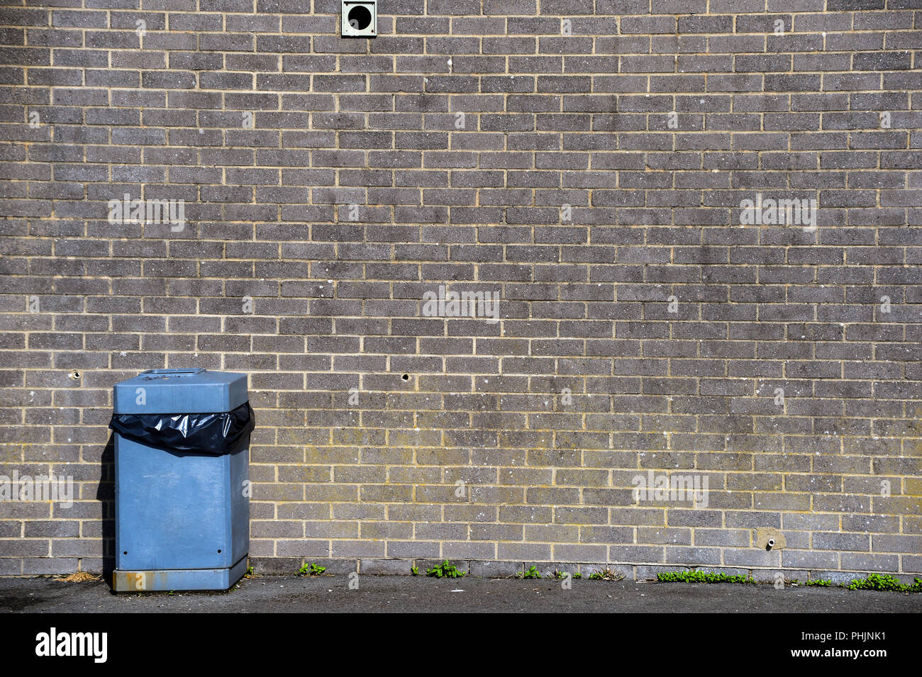 brick wall with bin Stock Photo - Alamy