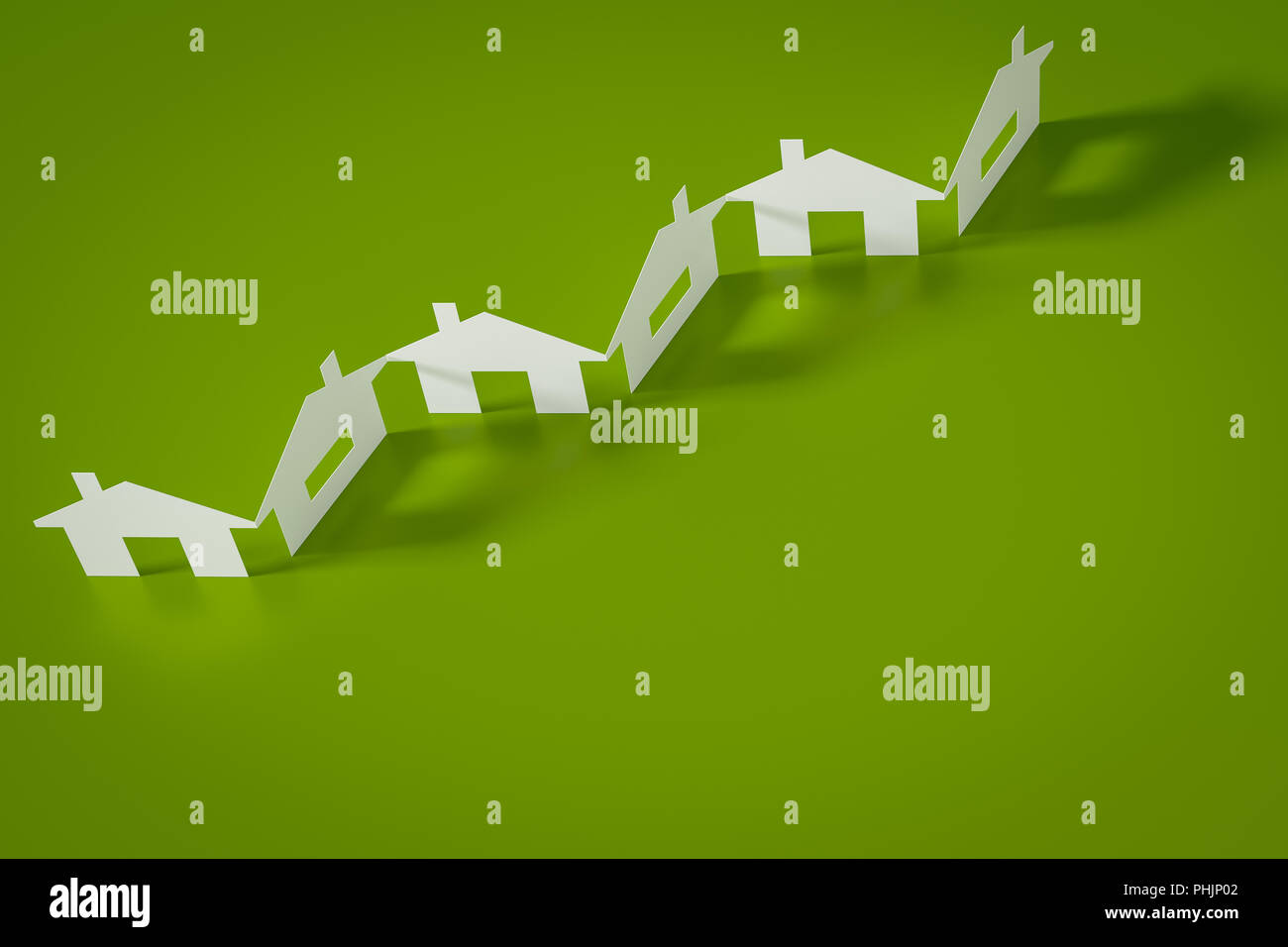 a paper cutout row of houses green background Stock Photo - Alamy