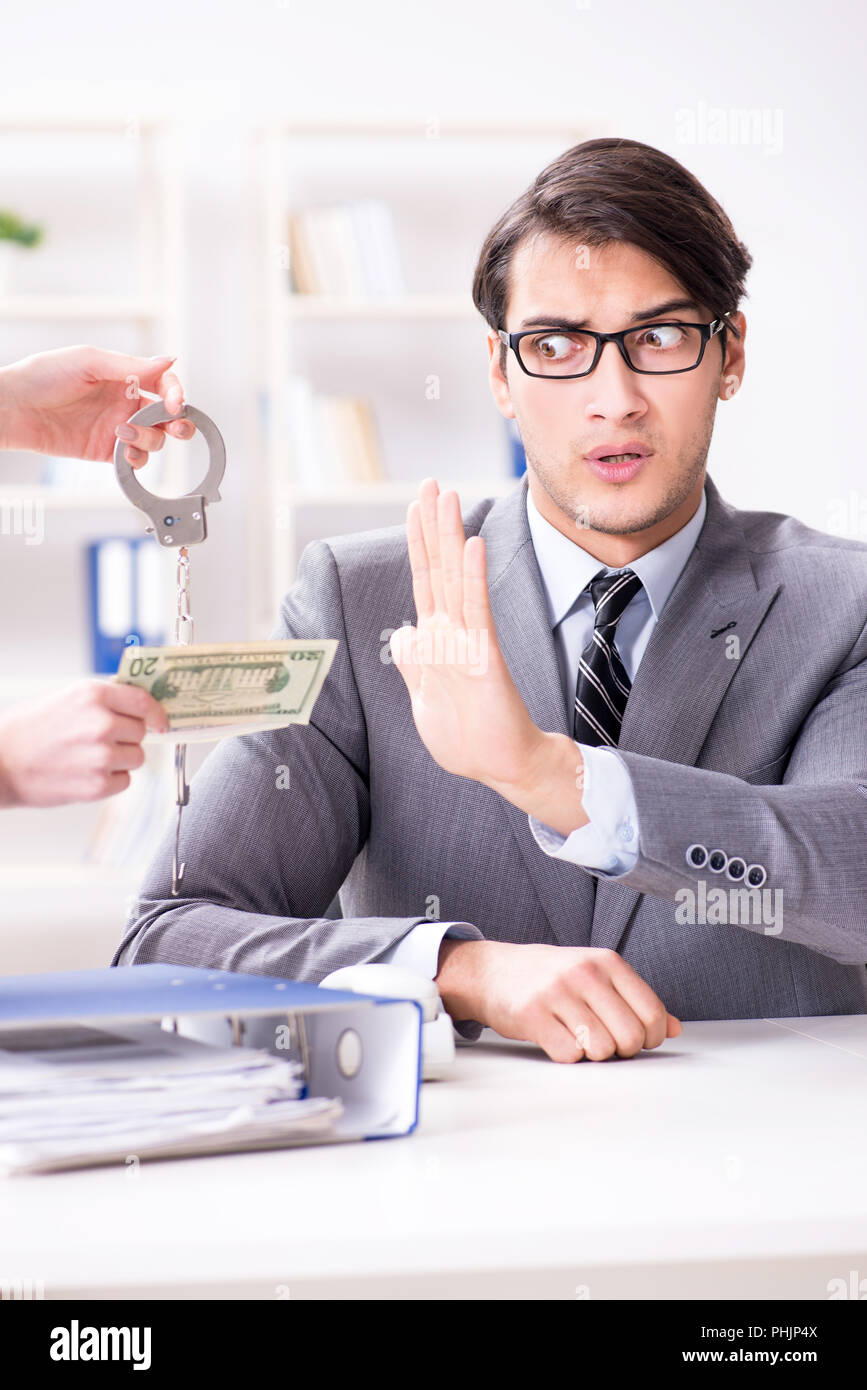 Businessmanbeing offered bribe for breaking law Stock Photo - Alamy