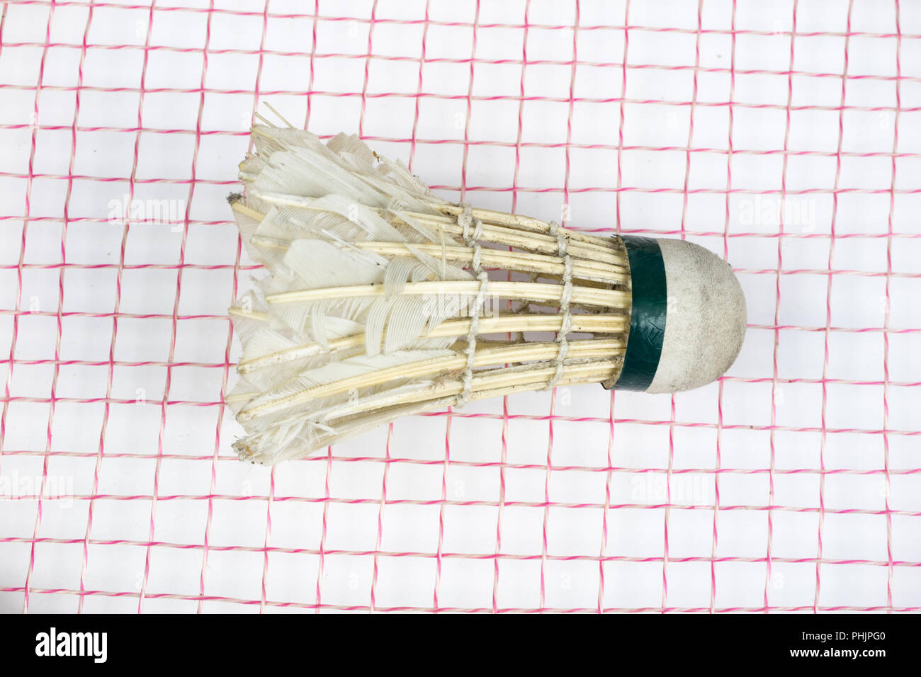 Old badminton accessories on a light table. Set for outdoor games and ...