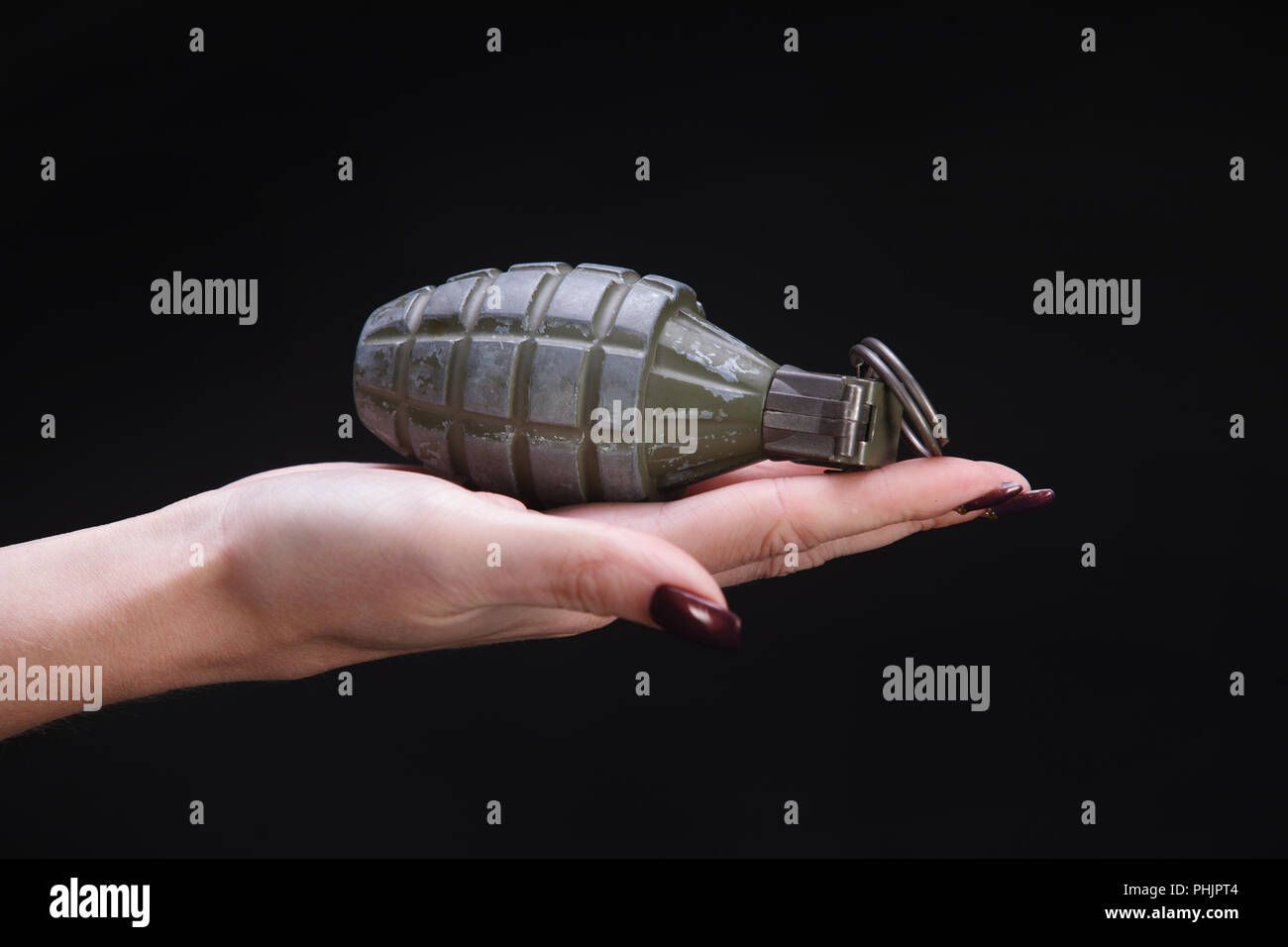 Hand grenade in hand pin hi-res stock photography and images - Alamy
