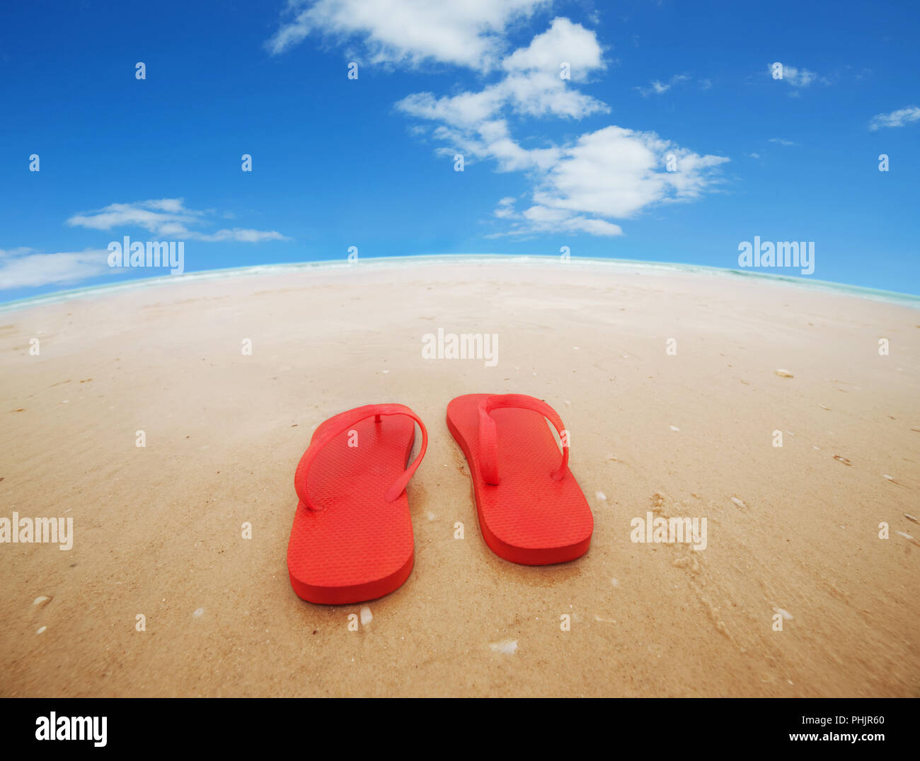 Red flip flops on the beach Stock Photo - Alamy