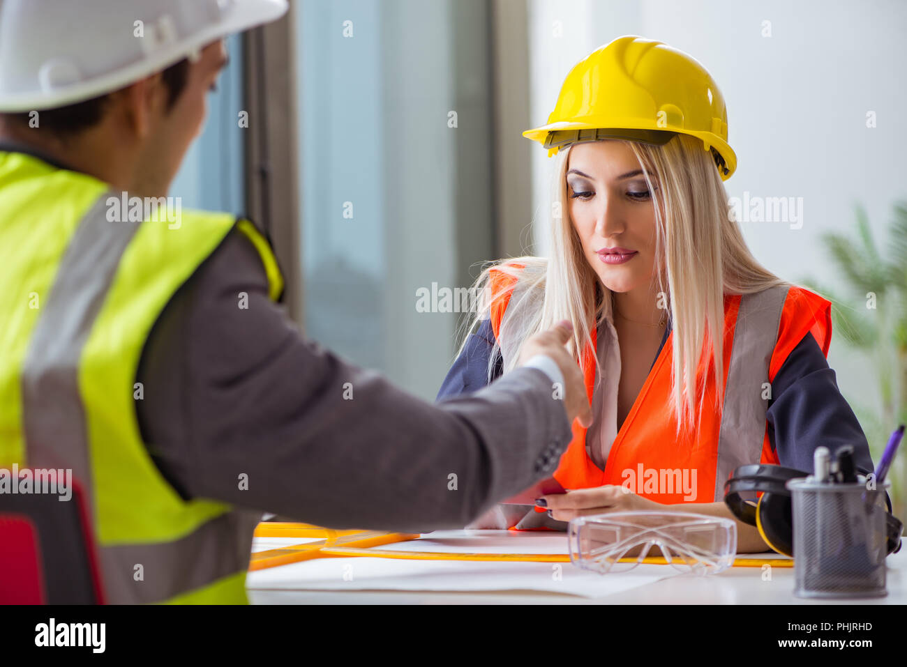 Construction workers having discussion in office before starting Stock ...
